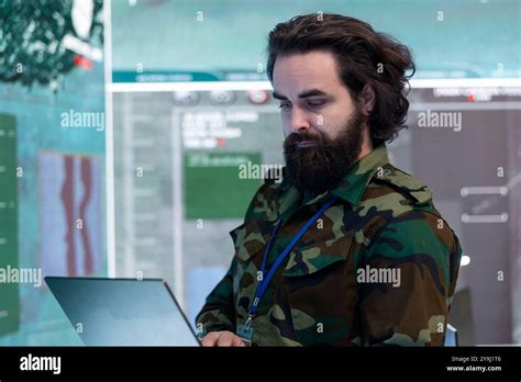 Technical Engineer Gathers Intelligence From World Map Projection Connected To Satellite