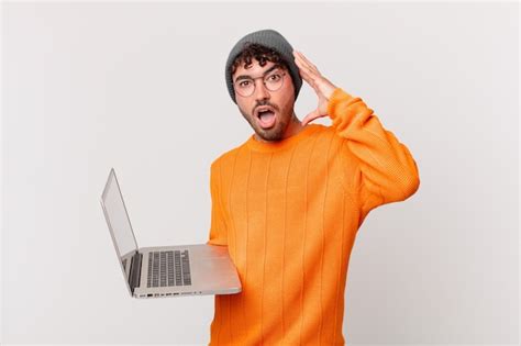 Premium Photo Nerd Man With Computer Screaming With Hands Up In The Air Feeling Furious