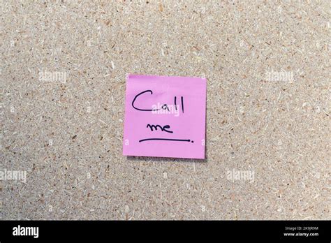Reminder Note Of Call Me On A Sticky Note On Notice Board Stock Photo Alamy