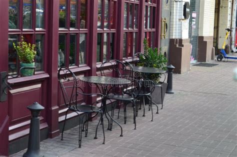 Outdoor Cafe With Wrought Iron Tables And Chairs Stock Image Image Of