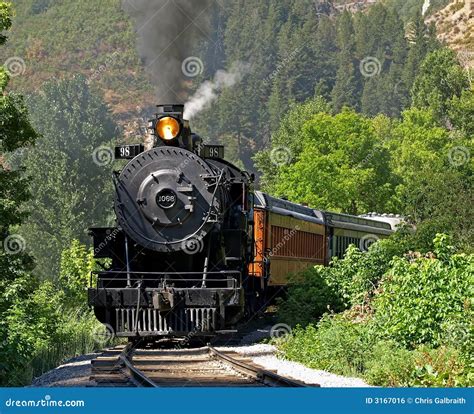 Steam Locomotive With Passenger Train Passed The Railway Curve Royalty