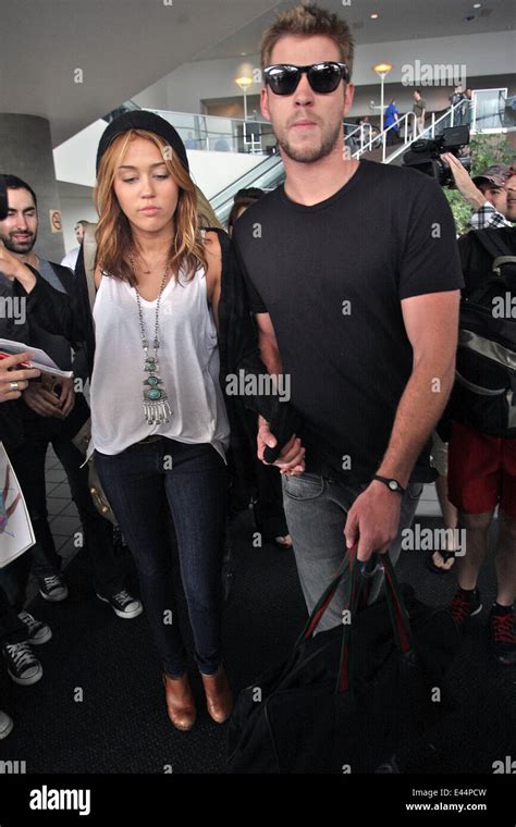 Miley Cyrus And Liam Hemsworth Miley Cyrus Arrives At Lax Airport On A