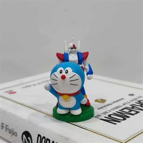 Mô Hình Doraemon Mini đế Xanh Chủ đề Truyện Dài Trong Trứng Socola