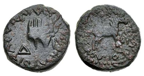 an ancient coin with a fork and knife on it