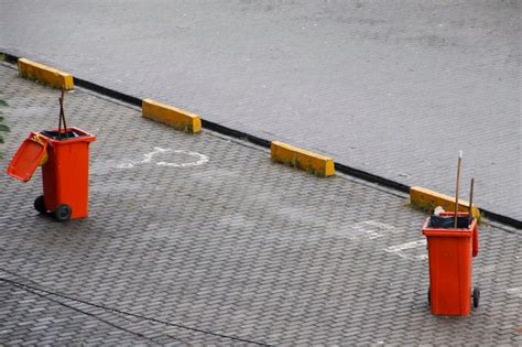 Premium Photo Colored Bins Of Garbage Collection Workers
