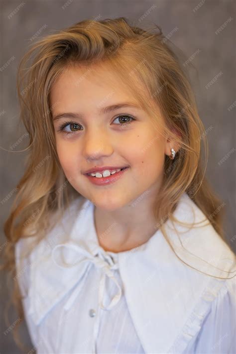 Premium Photo Portrait Of A Beautiful Longhaired Blonde Girl In A