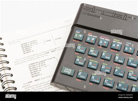 1982 Sinclair Zx Spectrum And Basic Programming Manual On Off White Background Ancient Vintage