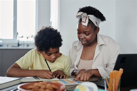 Premium Photo Mom Helping Her Son With Homework