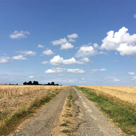 Premium Photo Road Passing Through Field