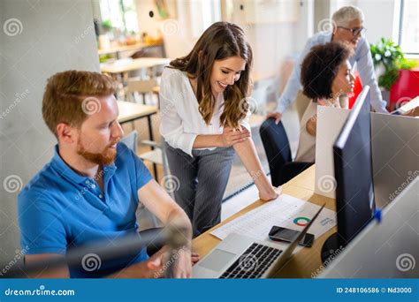 Group Of Programmer Working In A Software Developing Company Office