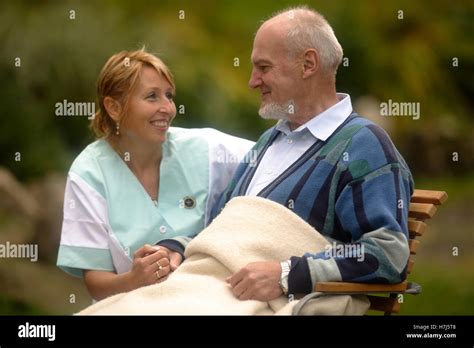 Old Man With Nurse Stock Photo Alamy