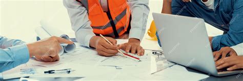 Premium Photo Architect Or Engineer Working On Building Blueprint