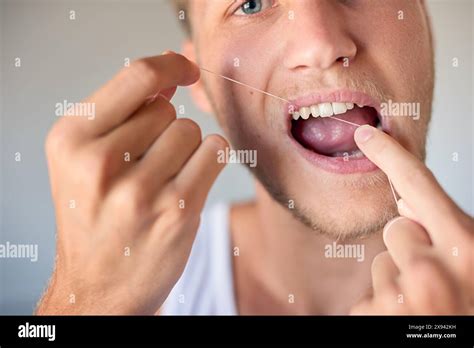 Self Care Portrait And Man Flossing Teeth In Home For Health Grooming