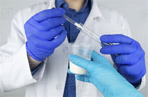 Medical Laboratory Assistant Checks A Test Tube With Sperm Spermogram Male Fertility Test