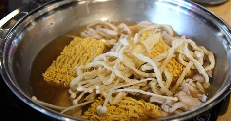 Lid Of Bubbling Pot With Broth Boiling Beneath On A Modern Induction Stove In A Cozy Kitchen