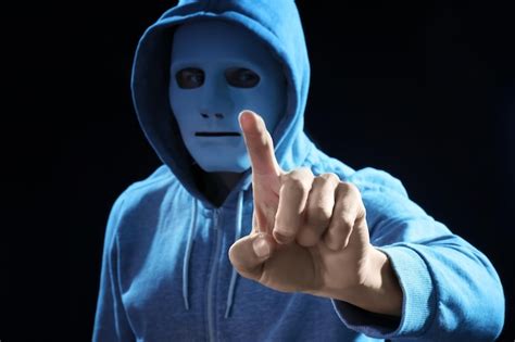Premium Photo Hacker Pushing Button On Virtual Screen Against Dark Background