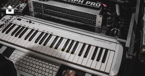 Man Using Keyboard With Computer Setup Photo Free Human Image On Unsplash