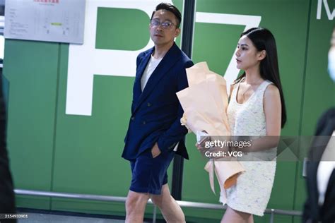 Wang Xiaofei And Wife Mandy Ma Xiaomei Are Seen At Shanghai Hongqiao