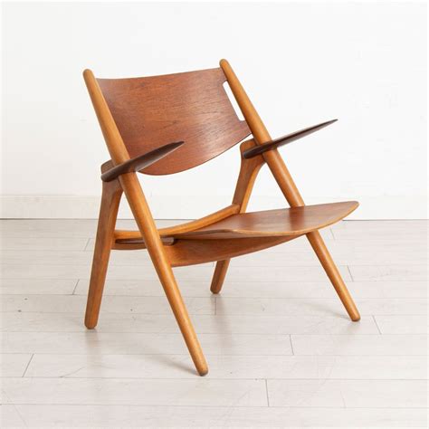 Early Edition Hans J Wegner Sawback Model Ch28 Lounge Chair By Carl