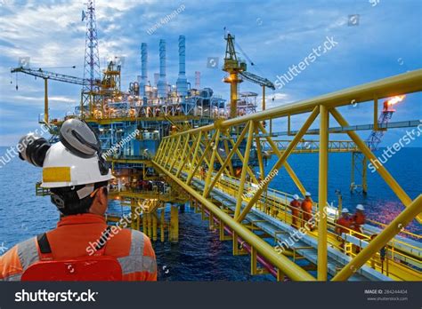 Worker And Offshore Rig Background Sponsored Spon Offshore Worker Background Rig Gas