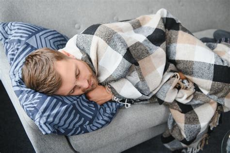 Sick Man Lying On Sofa At Home Stock Photo Image Of Home Health 256452530