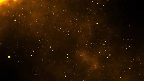 Beautiful floating Gold Glitter Particles with dust on Black Background in Slow Motion. 3d ...