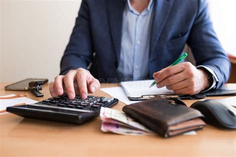 Businessman Using Calculator At Modern Office Business Analysis