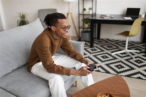 Premium Photo Man Holding Controller Medium Shot