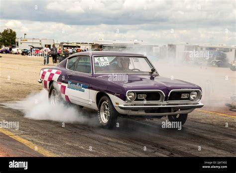 cuda dragster doing a burnout with smoke before drag race burnout at