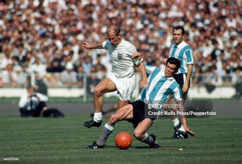 Bobby Charlton Of England Is Tackled During The Fifa World Cup News