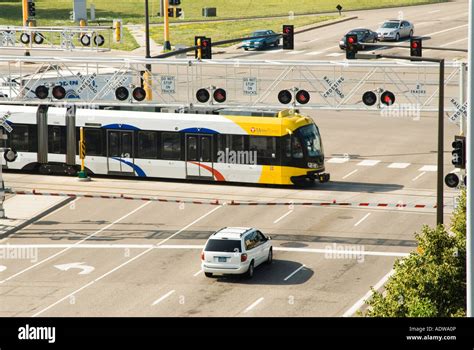 A Light Rail Mass Transit Train Crossing An Intersection In Bloomington