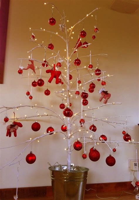 White Electrical Tape Wrapped Tree With Red Decorations Simply