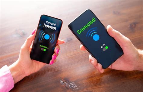 Premium Photo Two Persons Sharing Internet Between Their Phones By Using Personal Hotspot Feature