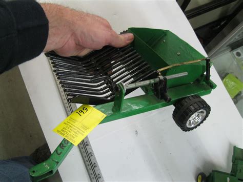 Tractor W Bailer And A Rock Picker