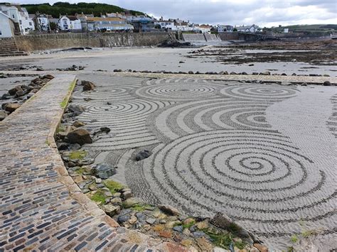 One Man And His Rake Sand Artist Chris Howarth
