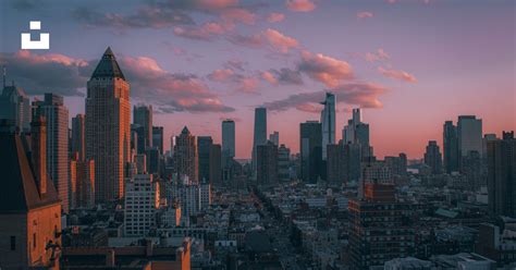City Skyline Under Cloudy Sky During Sunset Photo Free Grey Image On