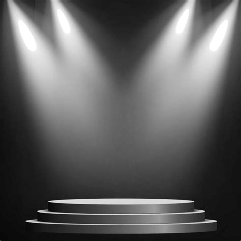An Empty Stage With Three Spotlights In The Center And Steps To The Right On A Black Background