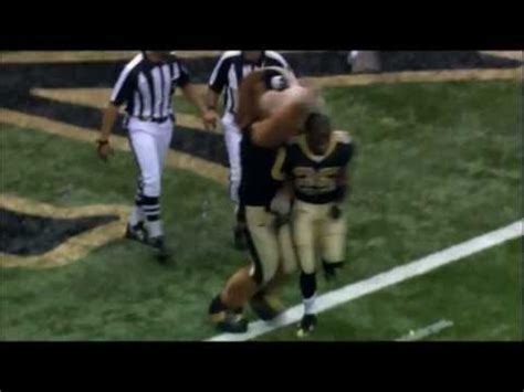 Reggie Bush Runs Over Gumbo The Dog After The Saints Win The 2009 Nfc
