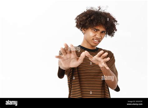 Portrait Of Guy Showing Stop Refusal Gesture Rejecting Smth With