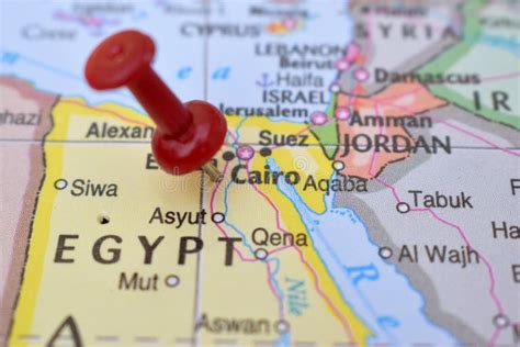 Red Push Pin Pointing Cairo On Location Of World Map Close Up View