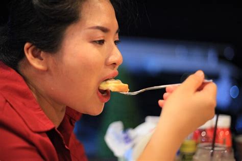 Premium Photo Close Up Of Woman Eating