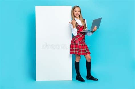 Full Length Portrait Of Charming Small Girl Hold Netbook Direct Finger