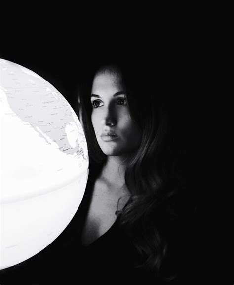 Premium Photo Close Up Of Woman Looking At Illuminated Globe