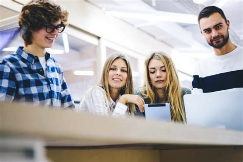 Young It Programmers Collaborating On Creating Application Using