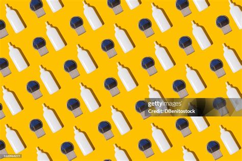 Lice Comb Pattern Of Metal And White Lice Shampoo Bottles On Yellow