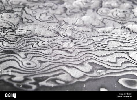 Background With Pattern Of Damask Steel Close Up Macro Shot Of A
