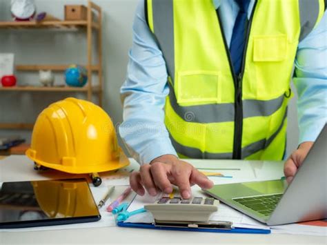 Architect Or Engineer Using Computer To Work On Desk Cost Calculation Construction Planning