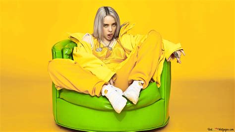 Billie Eilish Wearing All Yellow Outfit Sitting In A Green Couch 4k