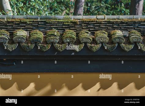 Ancient Chinese Wall With Classical Roof Tile Of An Old Temple Stock