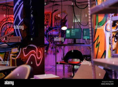 Computer Screen With Running Code Breaking Into Server In Abandoned Warehouse With No People